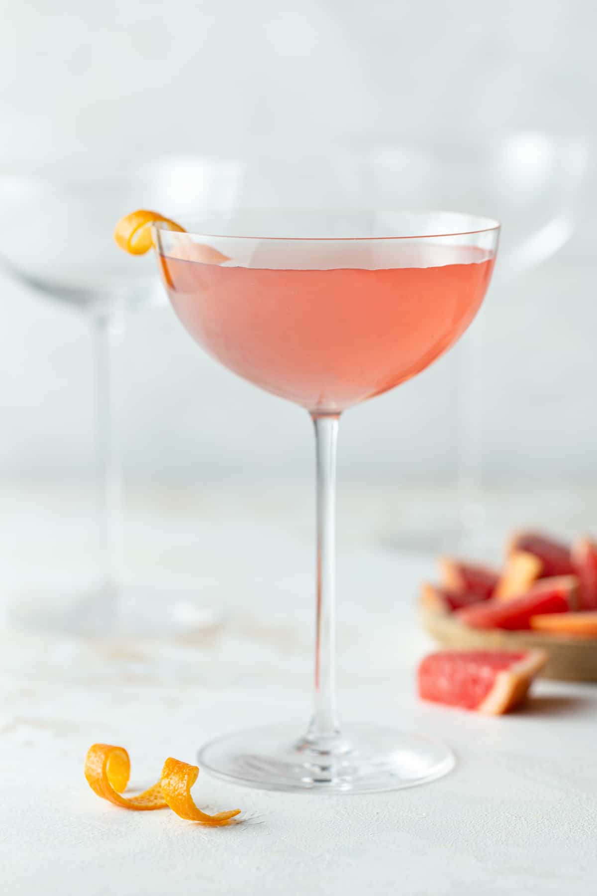 Grapefruit Martini -(made with gin or vodka) Garnish with Lemon