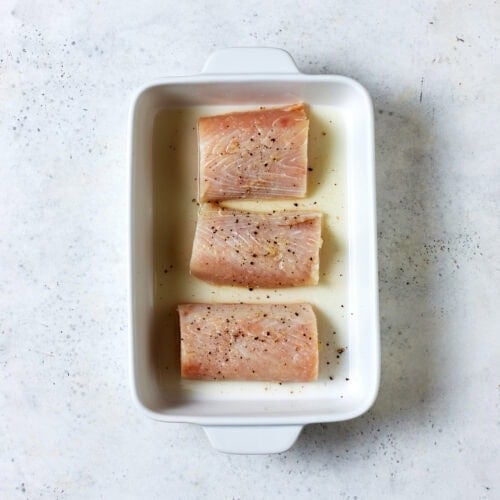 Baked Mahi Mahi Fish Recipe with Tomatoes & Olives - Garnish with Lemon
